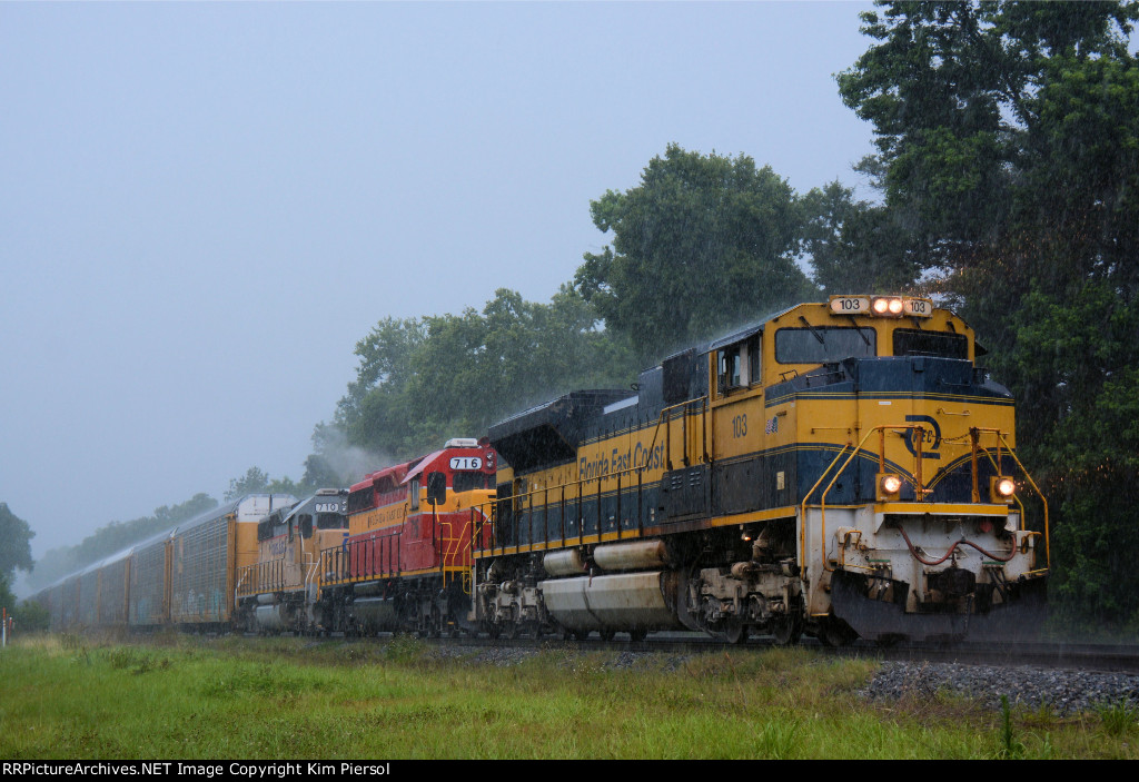 FEC 103 716 (Heritage) 710 on Train 101 in Driving Rainstorm